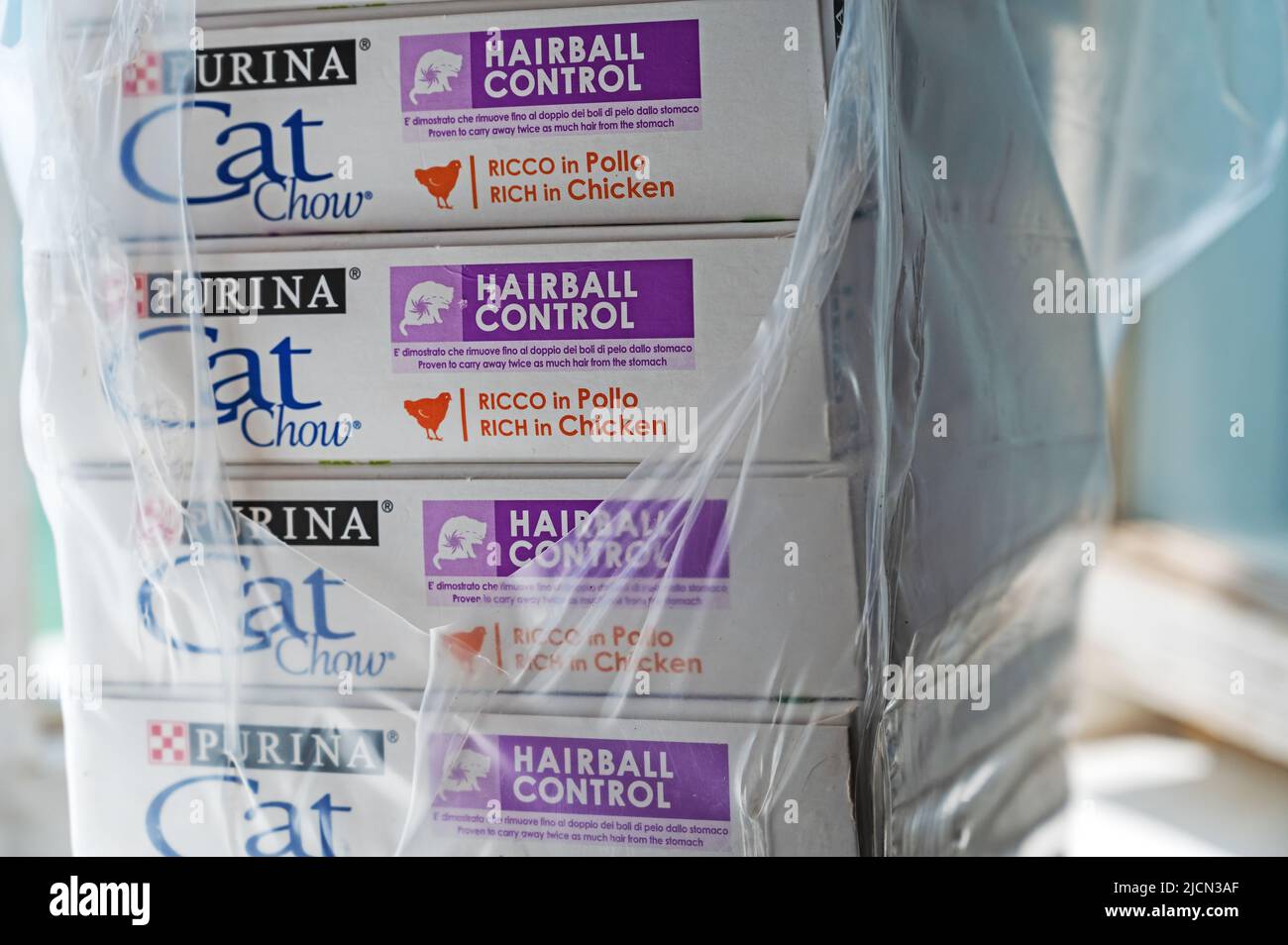 Close-up of white cardboard boxes of cat food. Pallet Purina Cat Chow ...