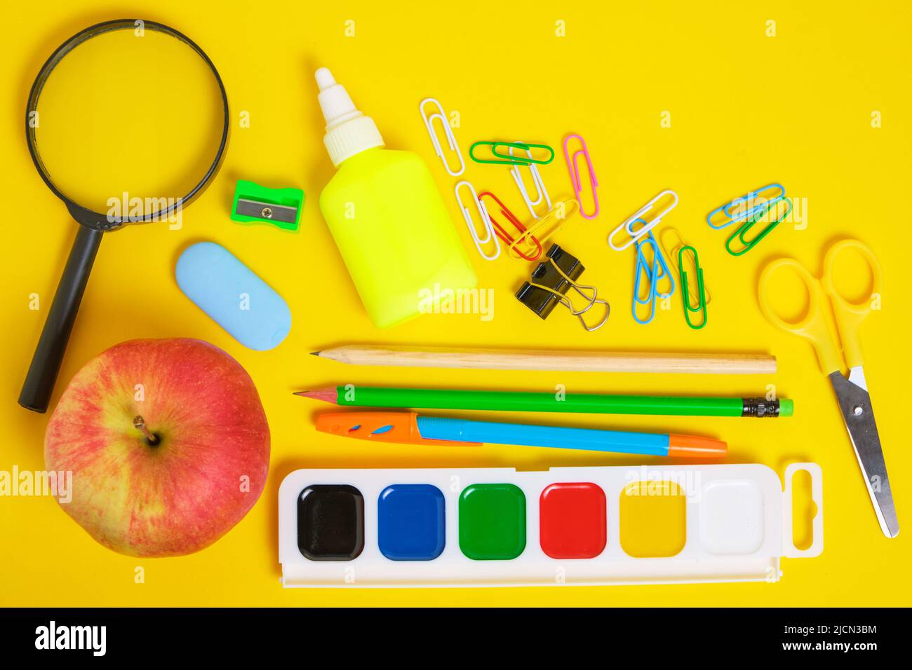 School supplies and stationery yellow background.Preparing child for ...