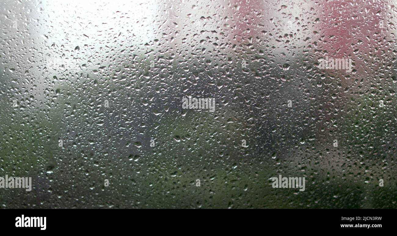 Droplets on window during rainy day Stock Photo - Alamy