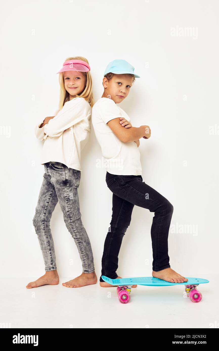 Portrait of two young smiling kids play more fun together light ...