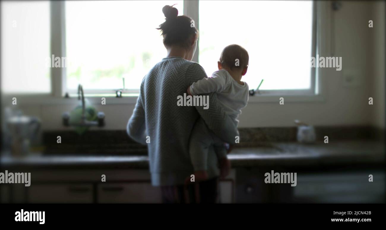 Mom multitasking in kitchen hi-res stock photography and images - Alamy