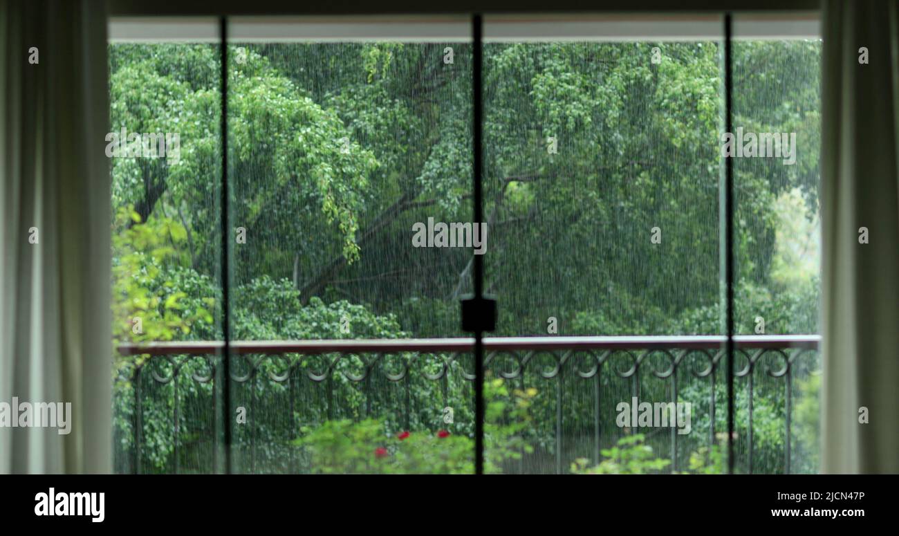 Pouring rain seen outdoors from home window Stock Photo - Alamy