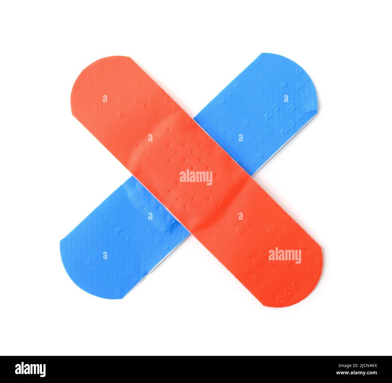 Crossed colorful red and blue adhesive bandage patches isolated on ...