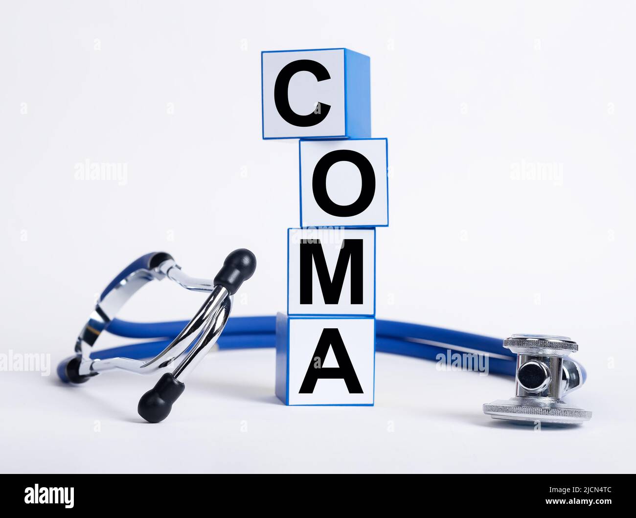Coma word on medical cubes on white background Stock Photo - Alamy