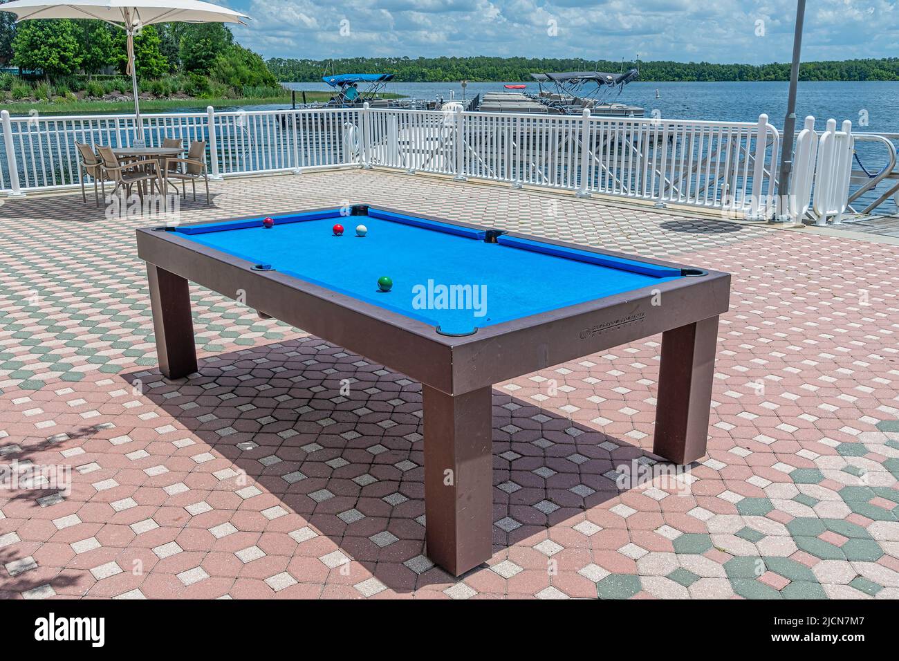 Outdoor green pool table in the sun Stock Photo - Alamy
