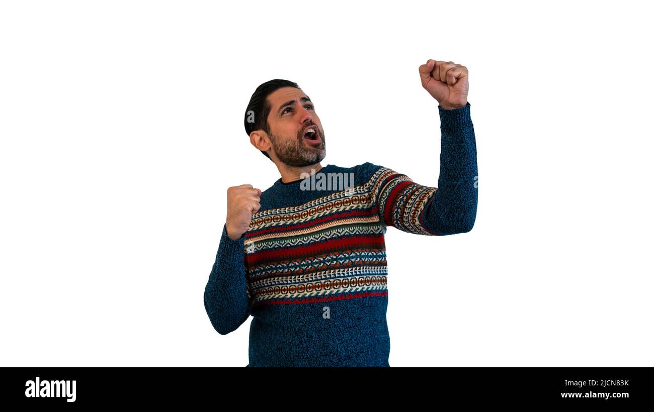 Portrait of joyous caucasian man celebrating with raised hand success ...