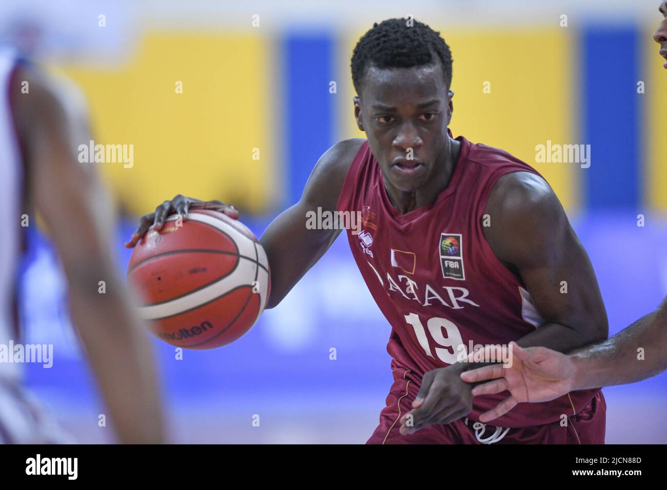 Doha, Qatar. 14th June, 2022. Moustapha Ndao of the Qatar Basketball team in action during the ...