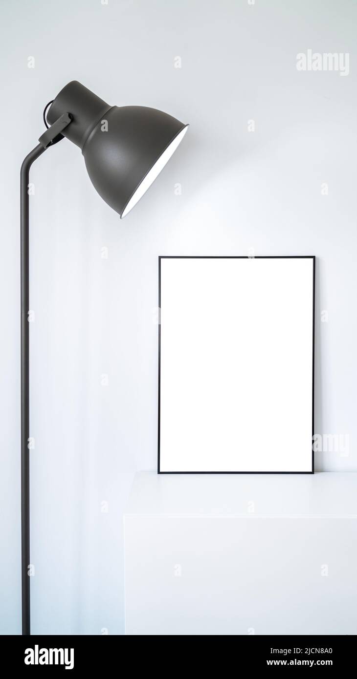 Modern panel with beautiful lamp in an office room. Minimalist black ...