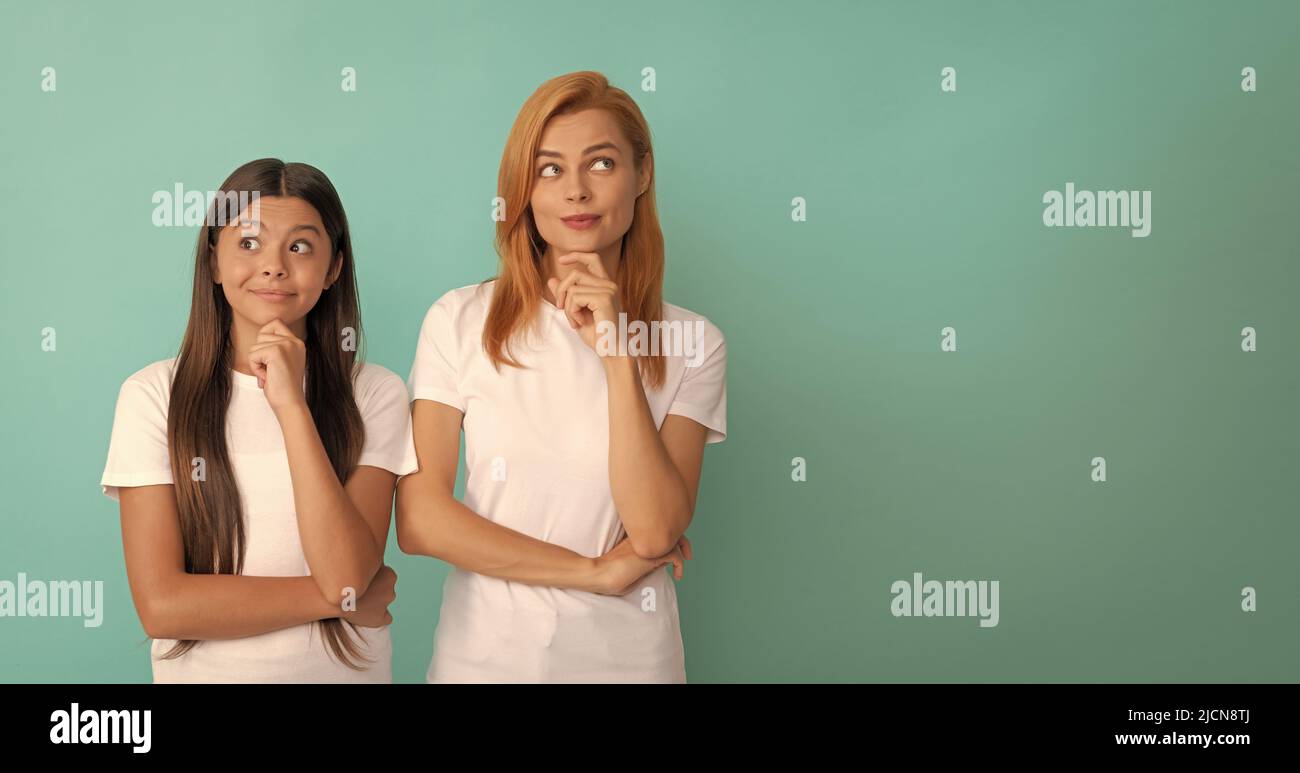 pondering mother and child with straight hair in white shirts, ponder ...