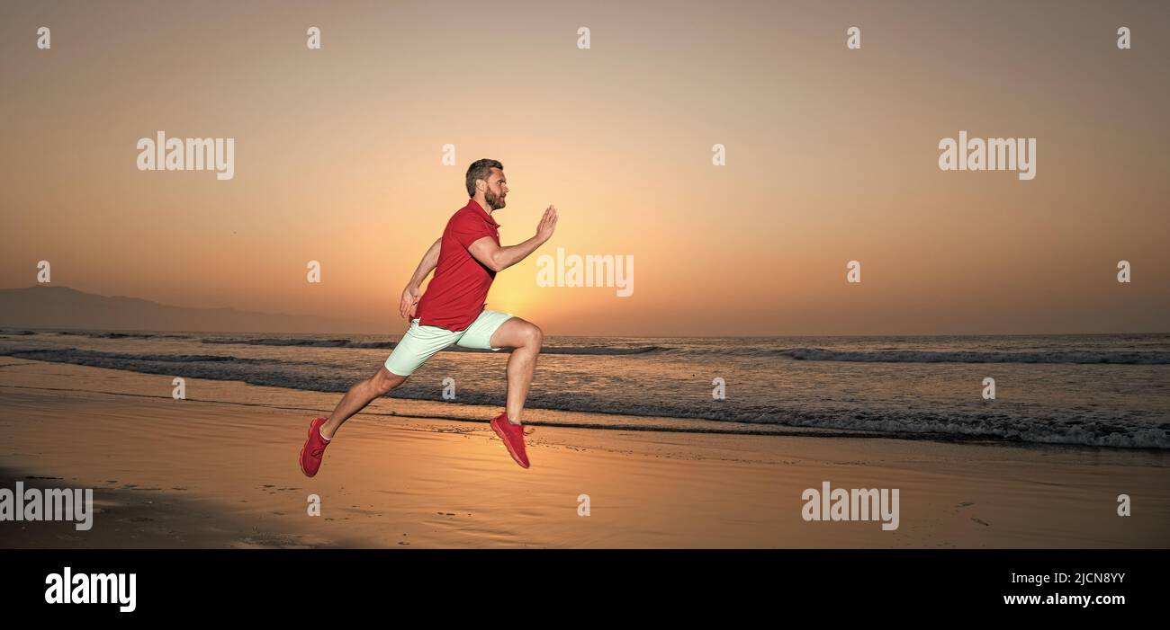 sportsman sprinter running on sunrise summer beach at ocean, copy space ...