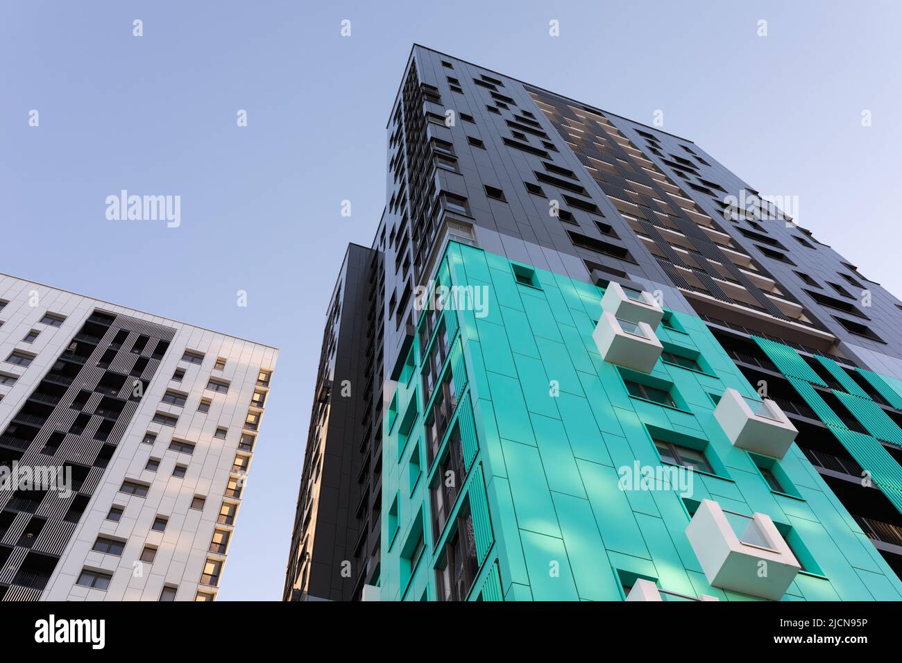 two high-rise residential buildings against the blue sky Stock Photo ...