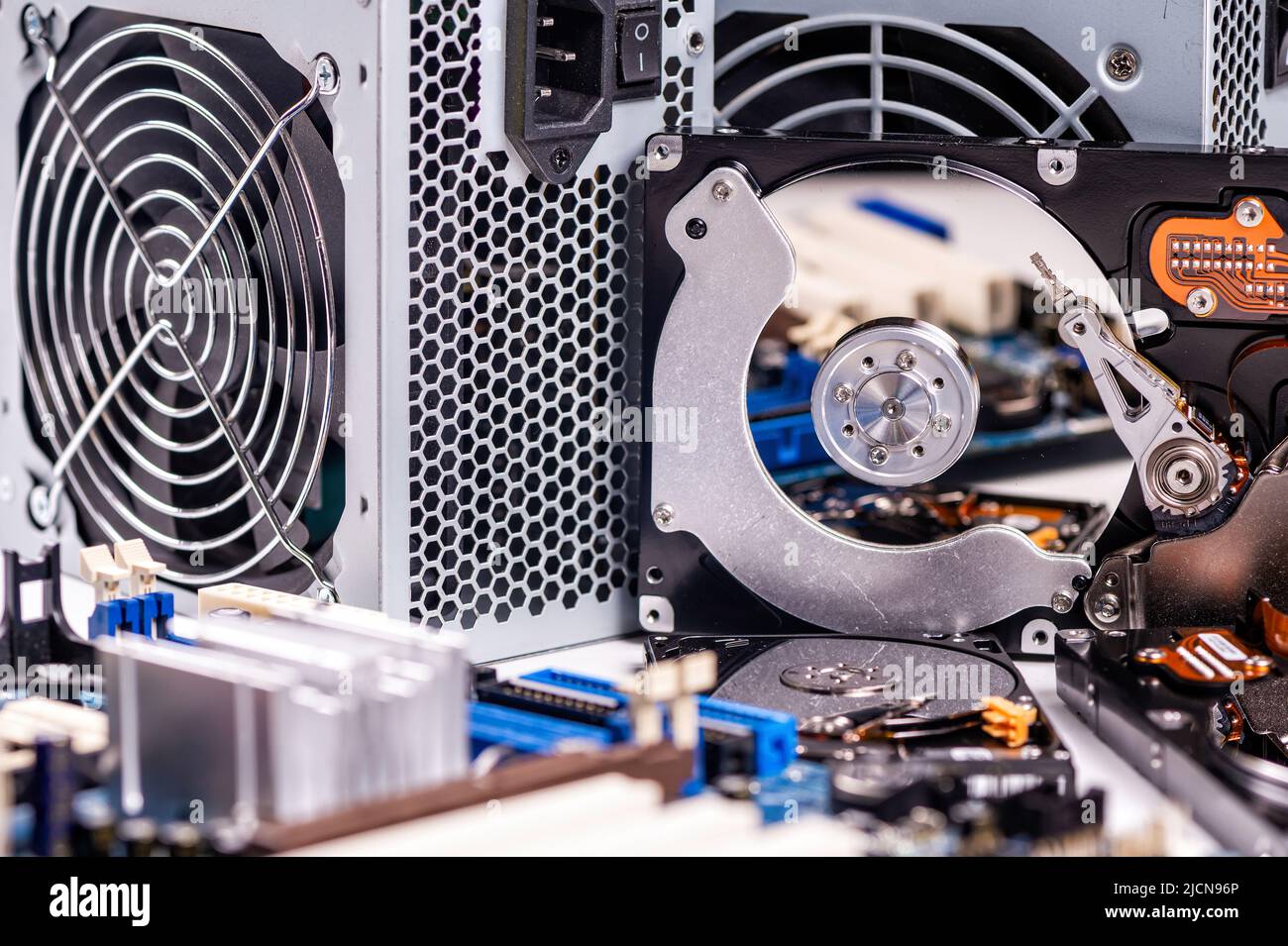 an open computer hard drive between other parts of the computer ...