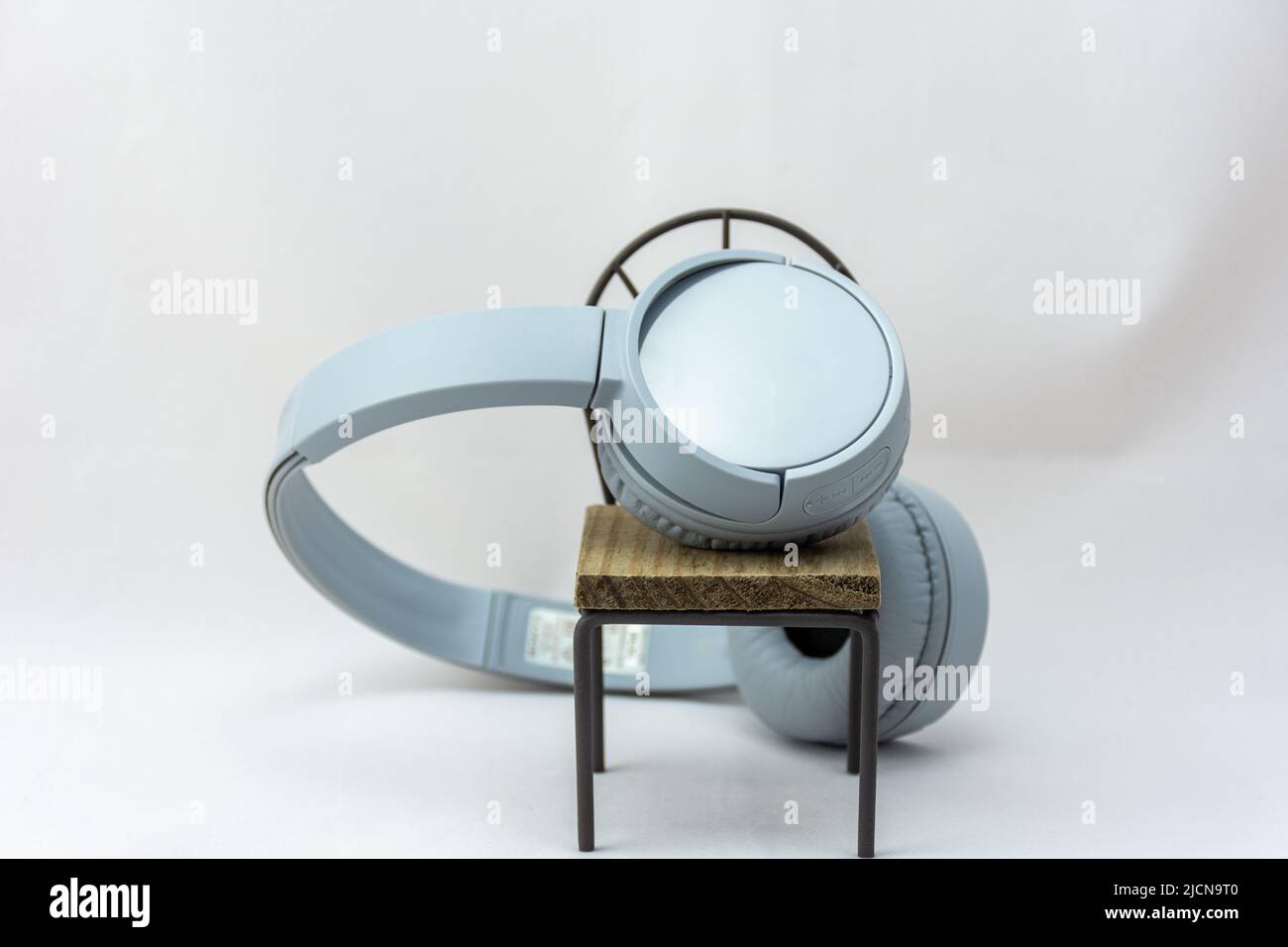 Close-up wireless headset on little chair isolated on white background ...