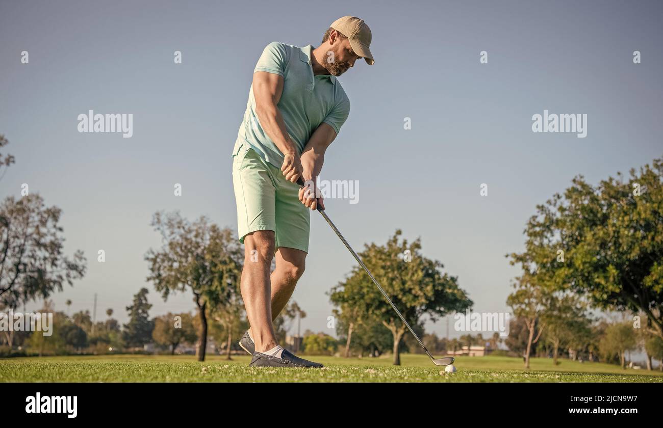 male golf player on professional golf course. portrait of golfer in cap ...