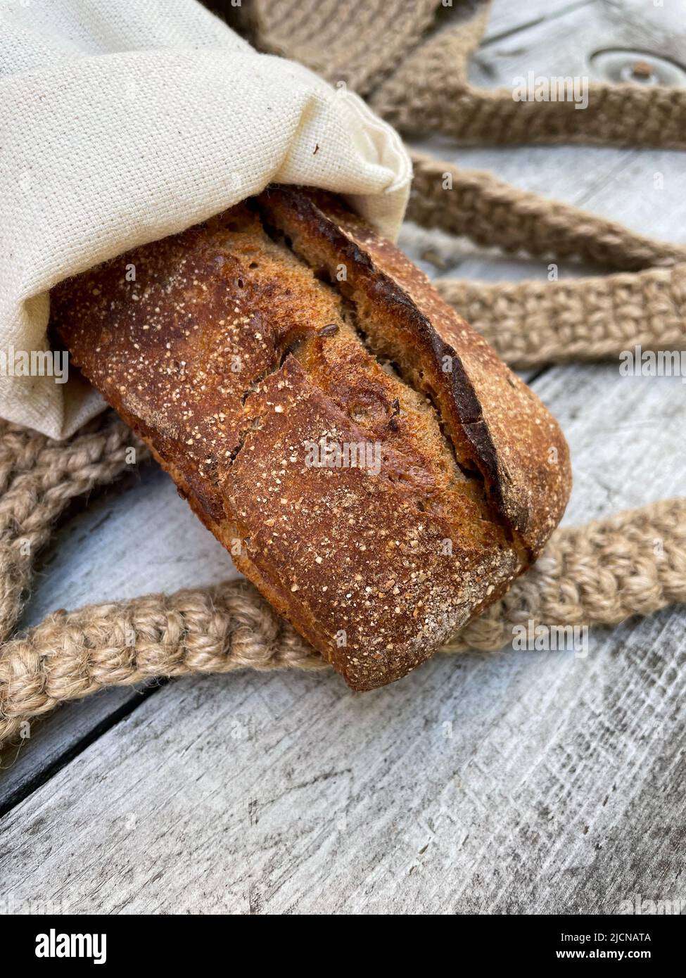 Breaking bread hands hi-res stock photography and images - Alamy