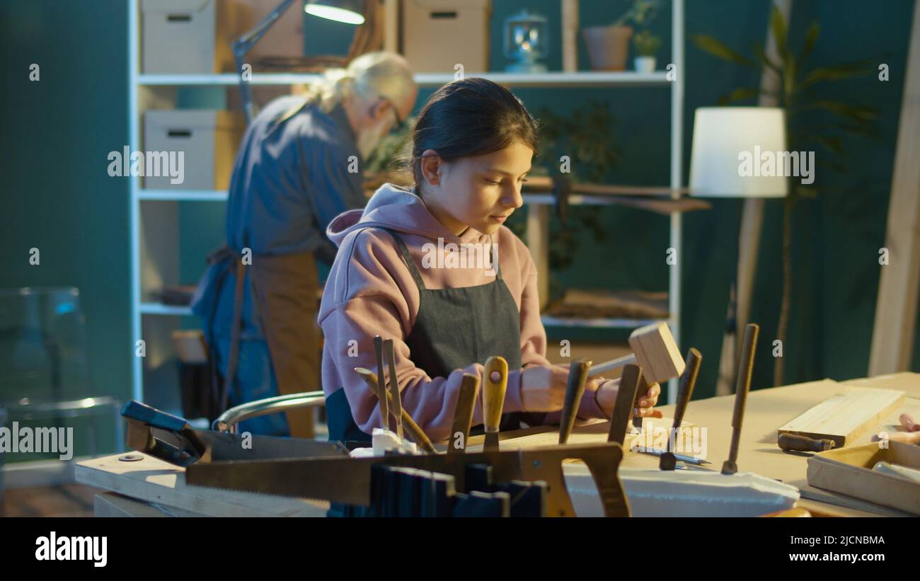 Teen Girl with Carpenter Grandfather Doing Woodcarving with Carpentry ...