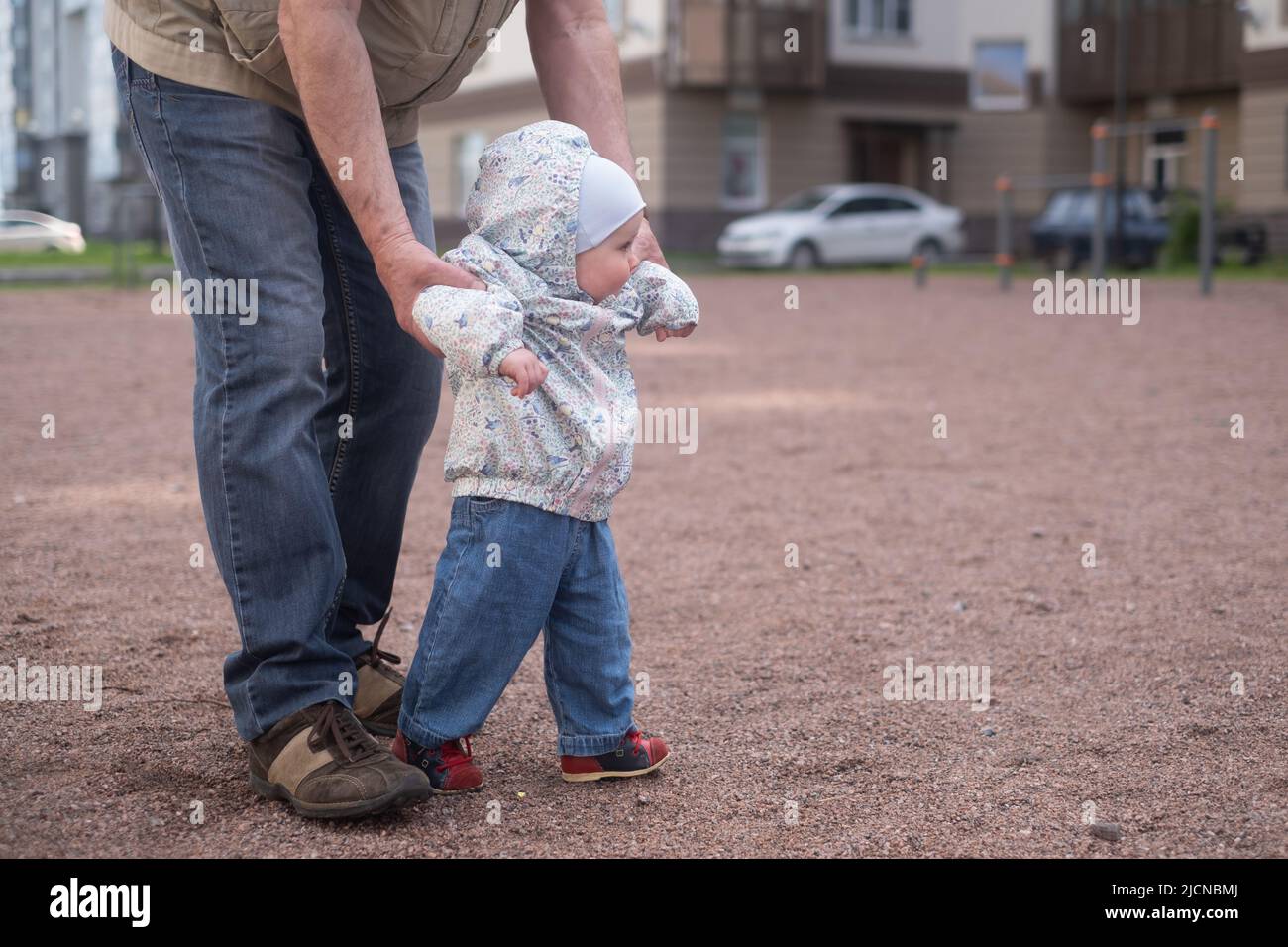 Child helping elderly walk hi-res stock photography and images - Alamy