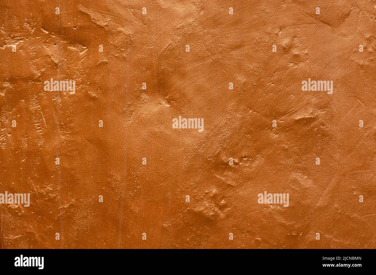 Copper textured background, reddish-orange metallic surface, painted ...