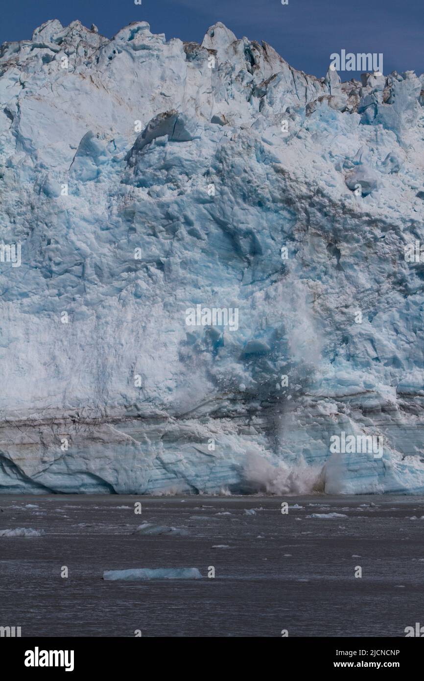 Ice falling into water from calving at Hubbard Glacier in ...