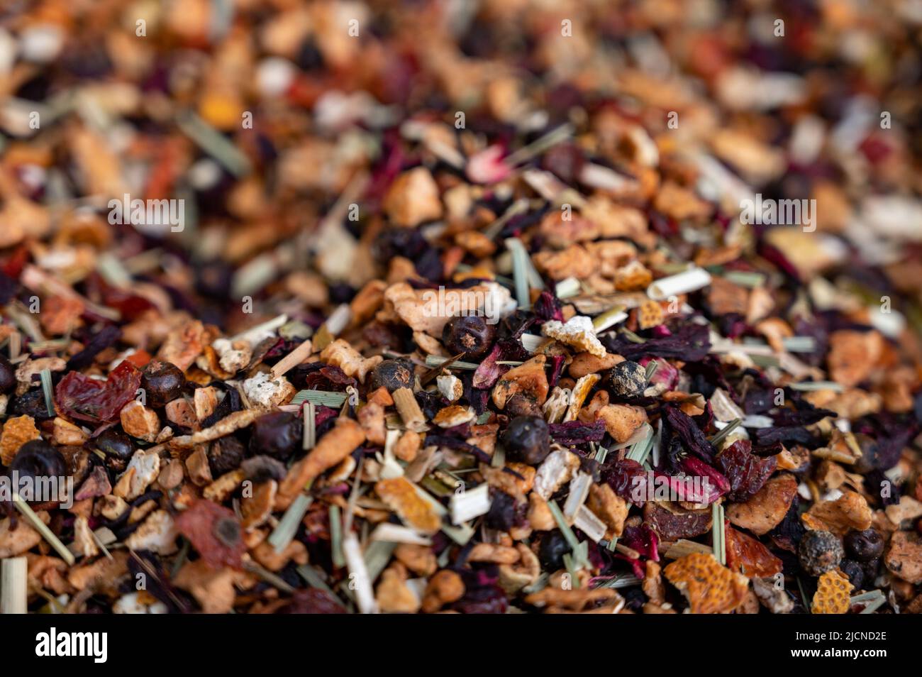 Blended black leaf dry tea with aromatic flowers, spices in tea shop in ...