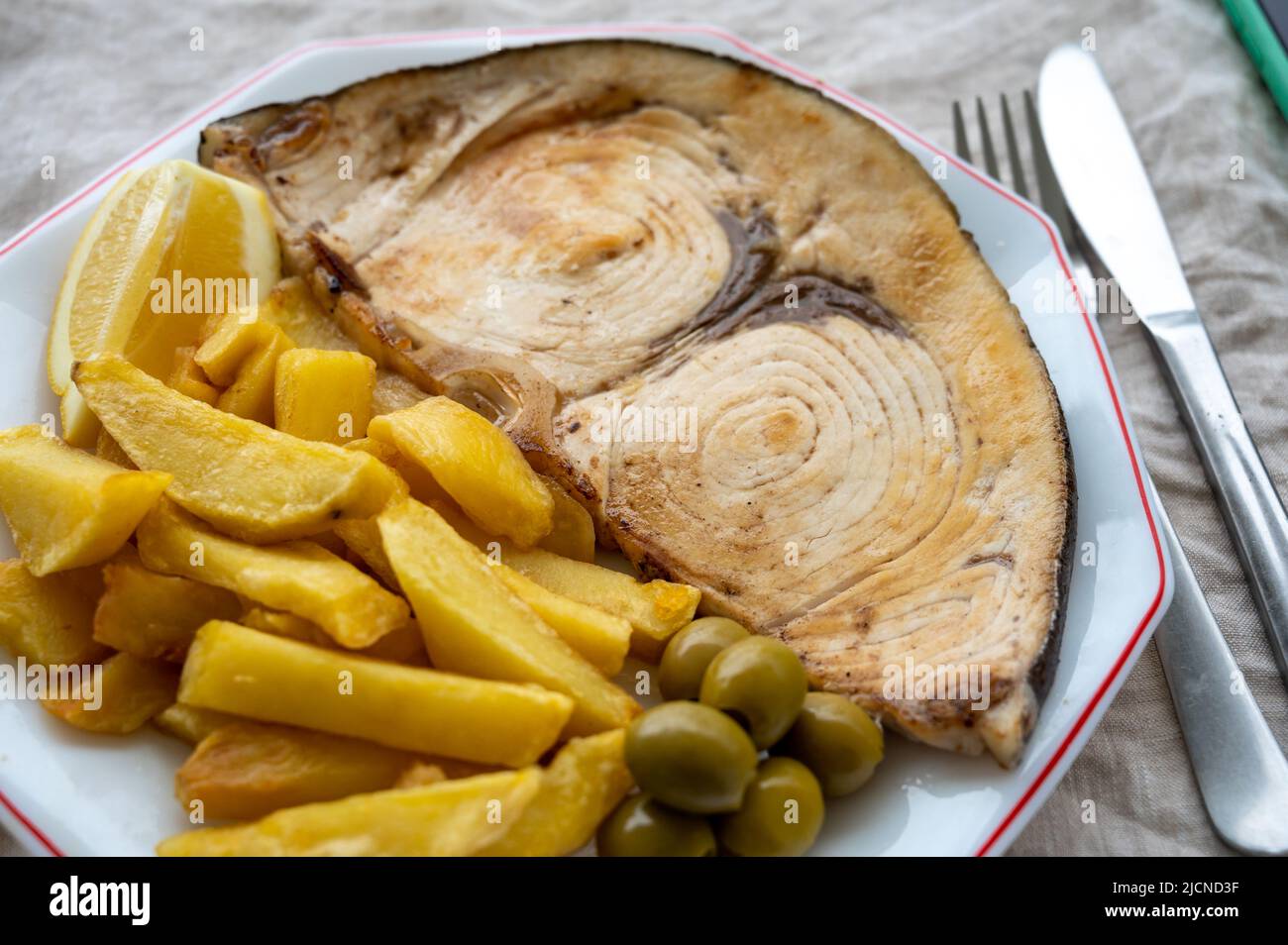 Seafood dish, grilled steak from swordfish or spada served with french ...