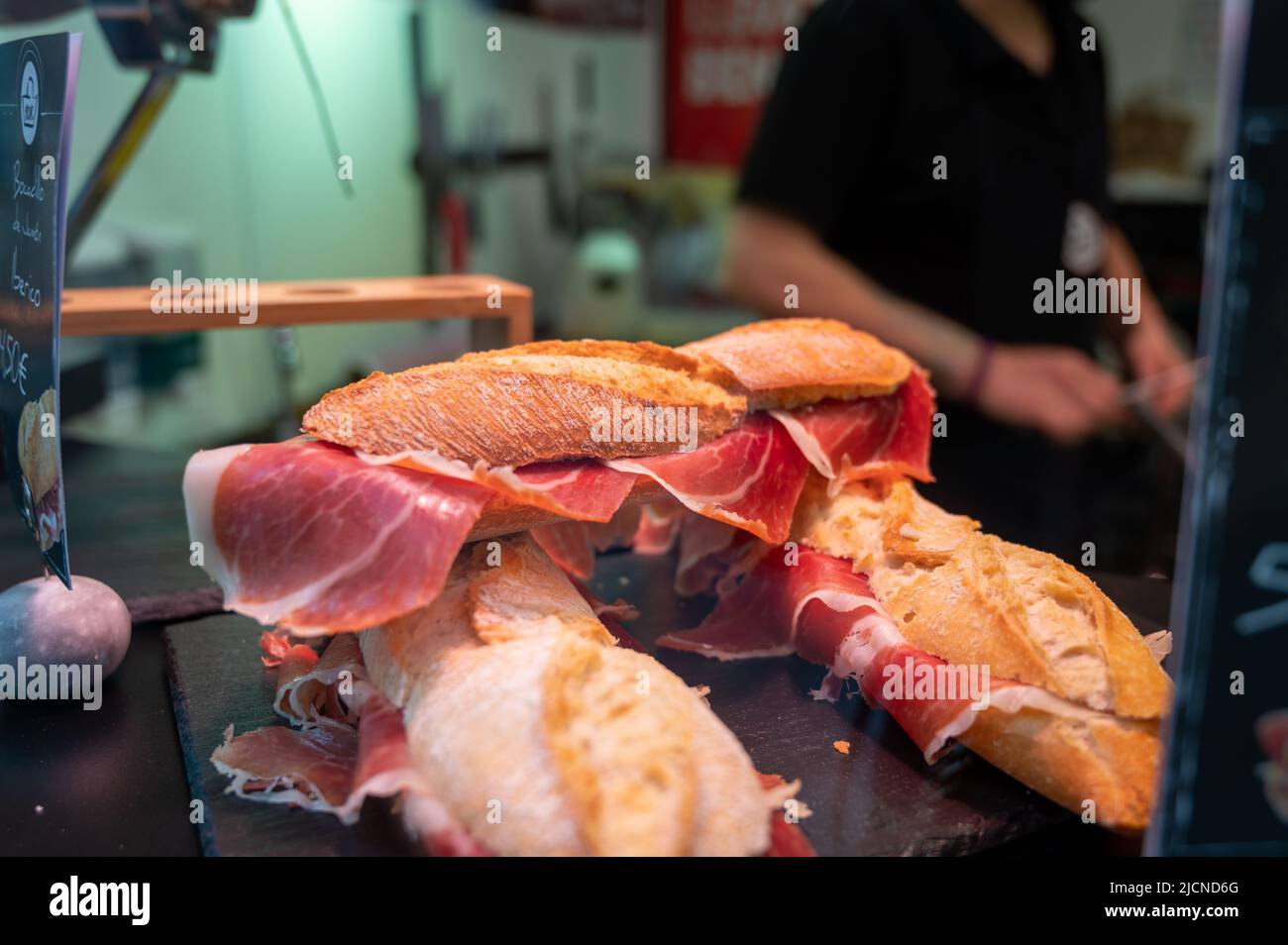 Spanish low cost street food, bocadillo bread sandwich dry-cured ham ...