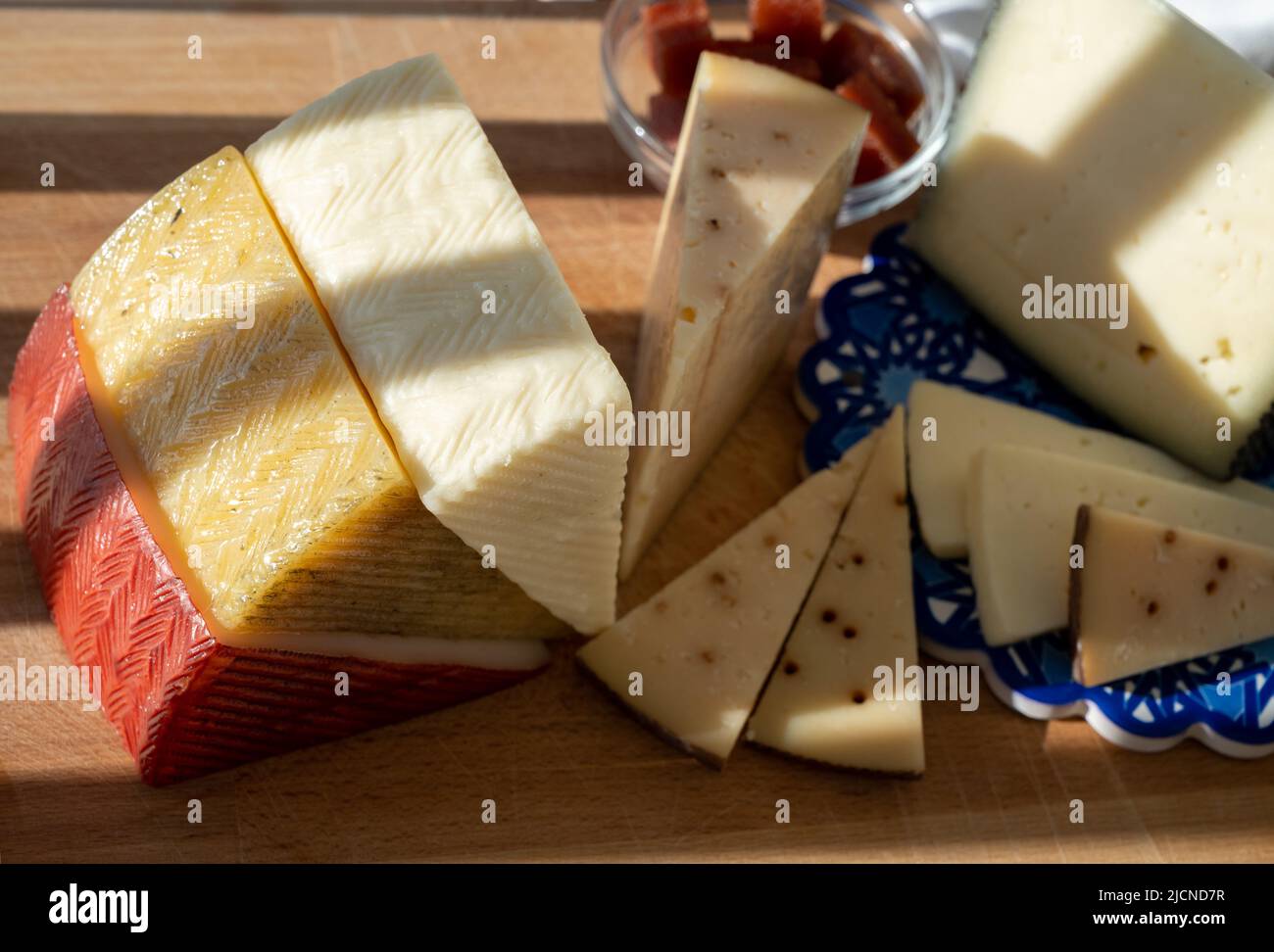 Spanish hard manchego, cow, sheep and goat cheeses served outdoor with ...