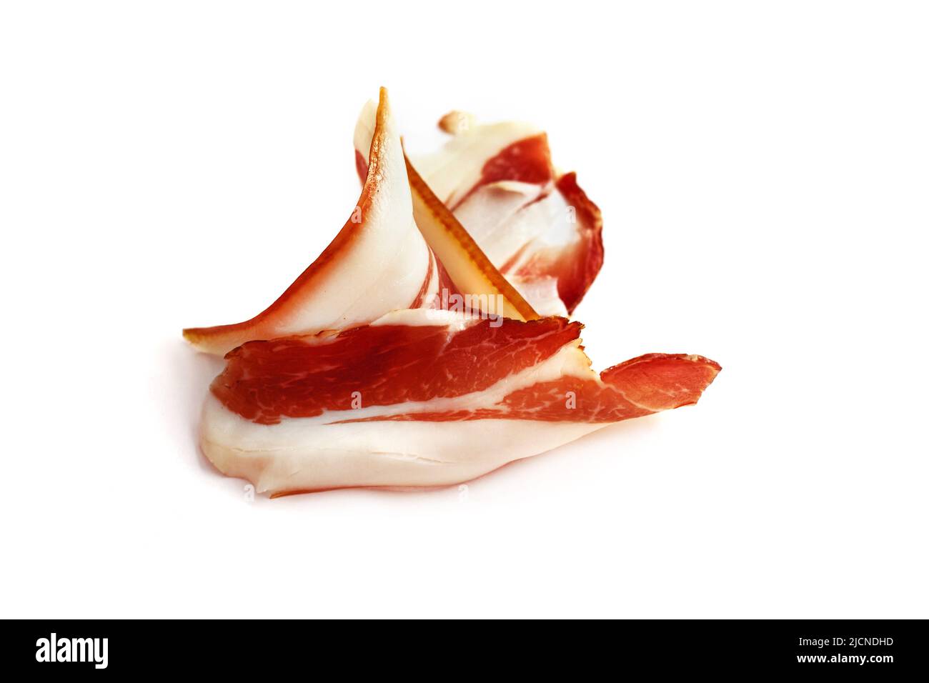 Parma ham slices isolated on white Stock Photo - Alamy