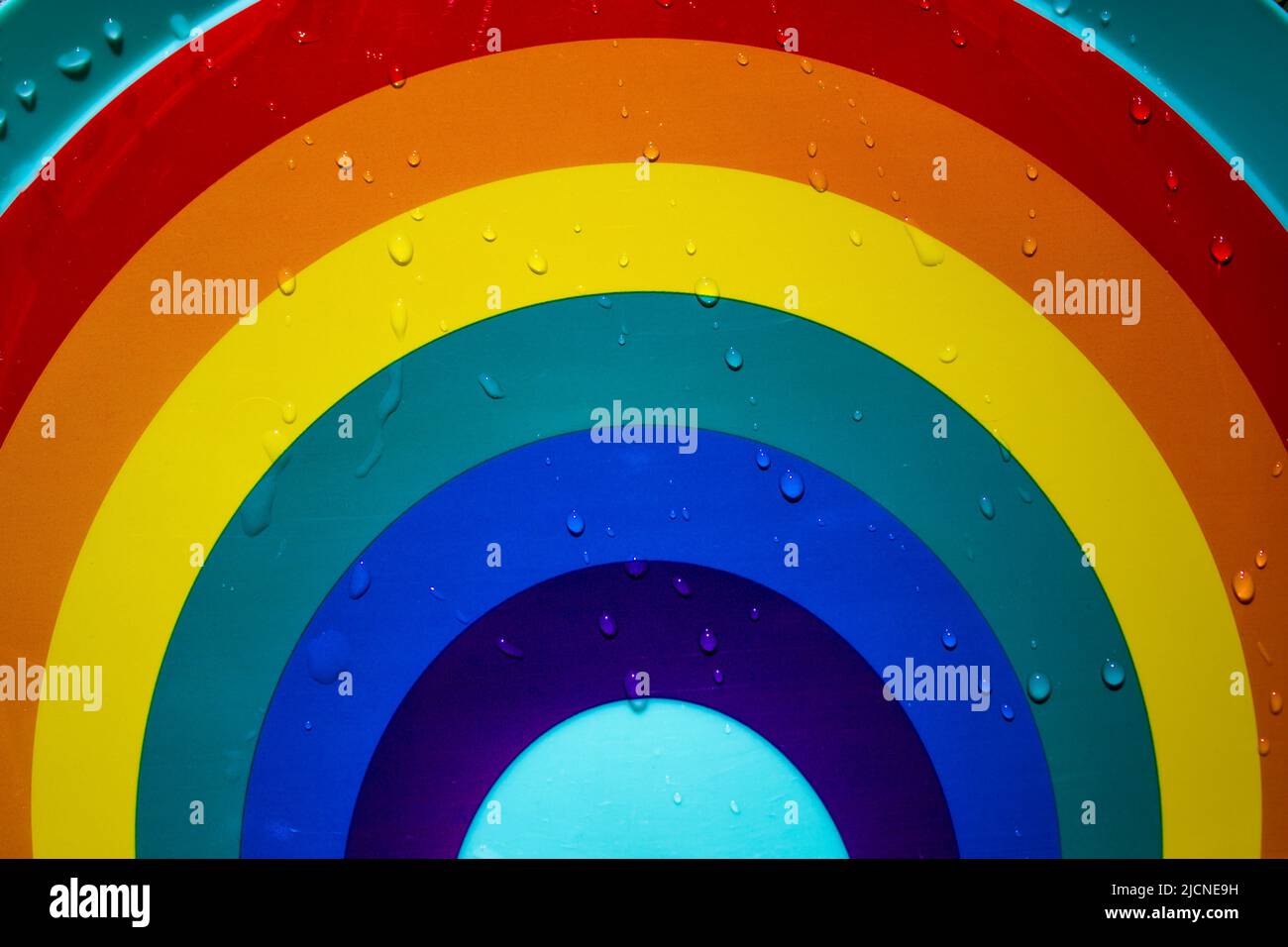 Multicolored rainbow with rain drops background. LGBT, LGBTQ symbol ...