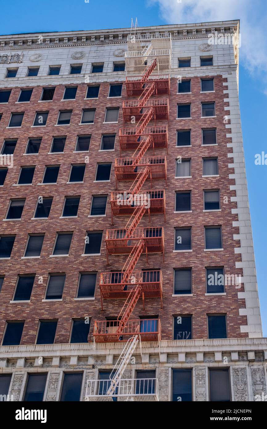 Red Metal Fire Escape on Old Brick Building Stock Photo - Alamy