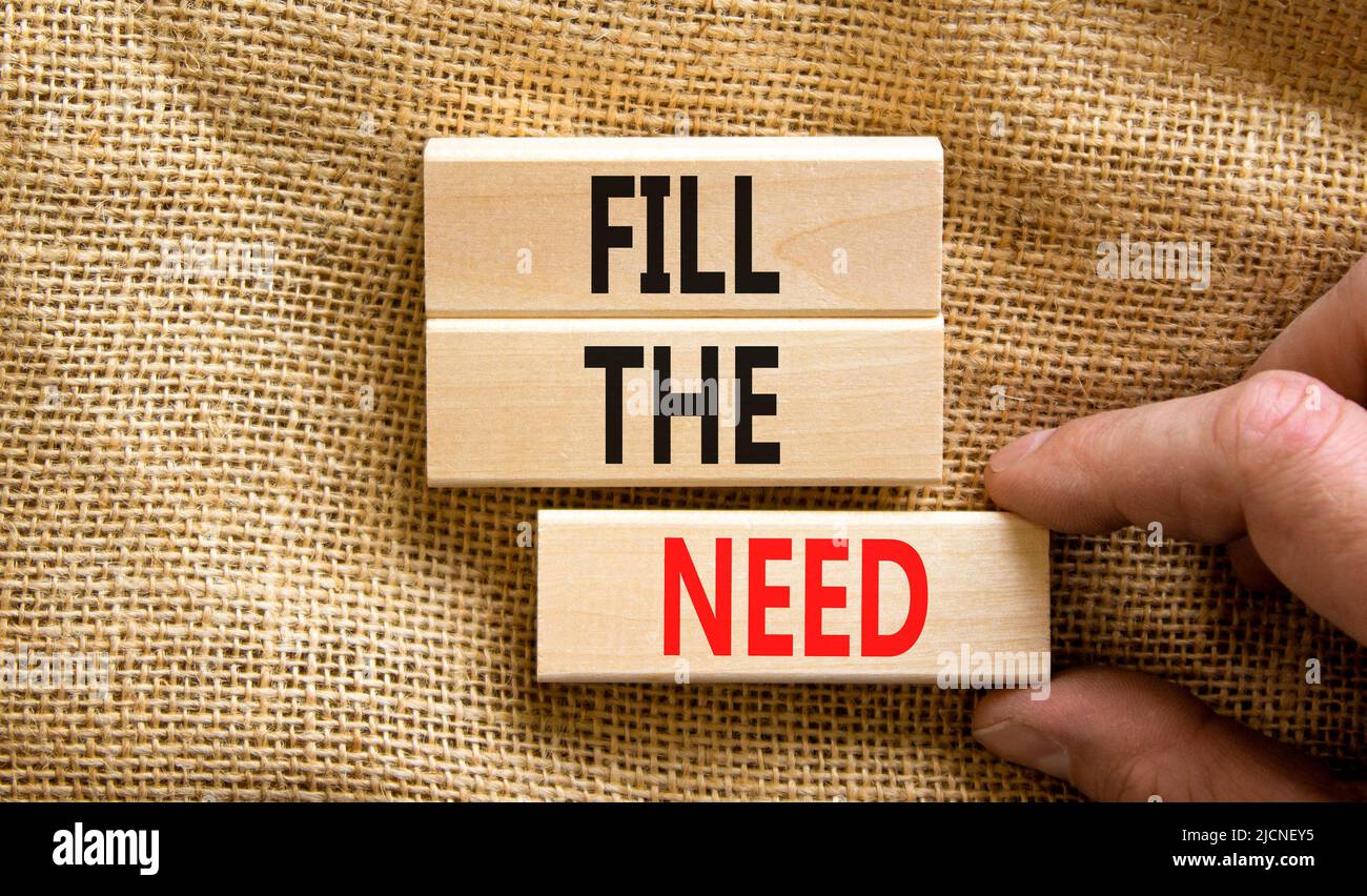 Fill the need symbol. Concept words Fill the need on wooden blocks on a ...