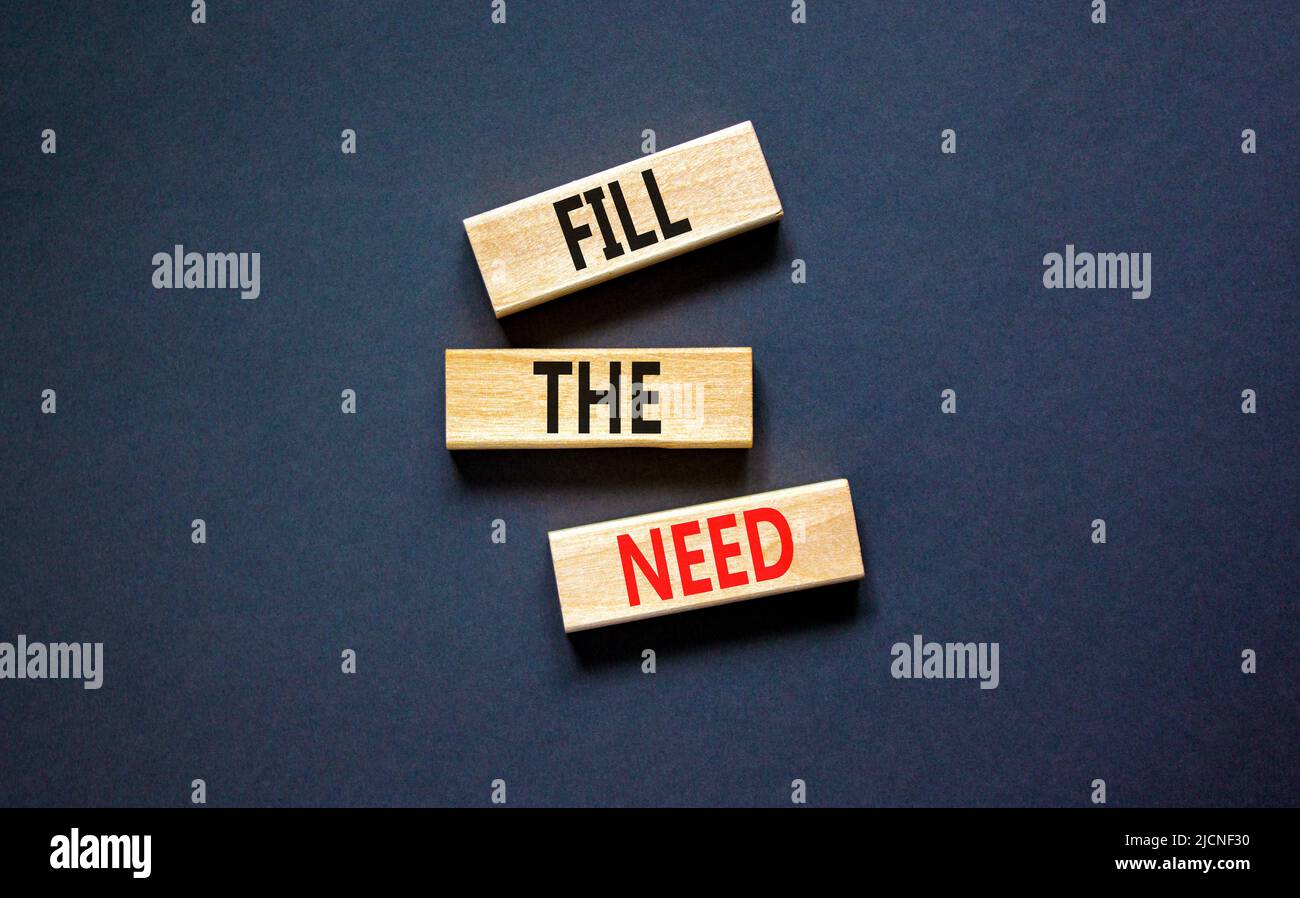 Fill the need symbol. Concept words Fill the need on wooden blocks on a ...
