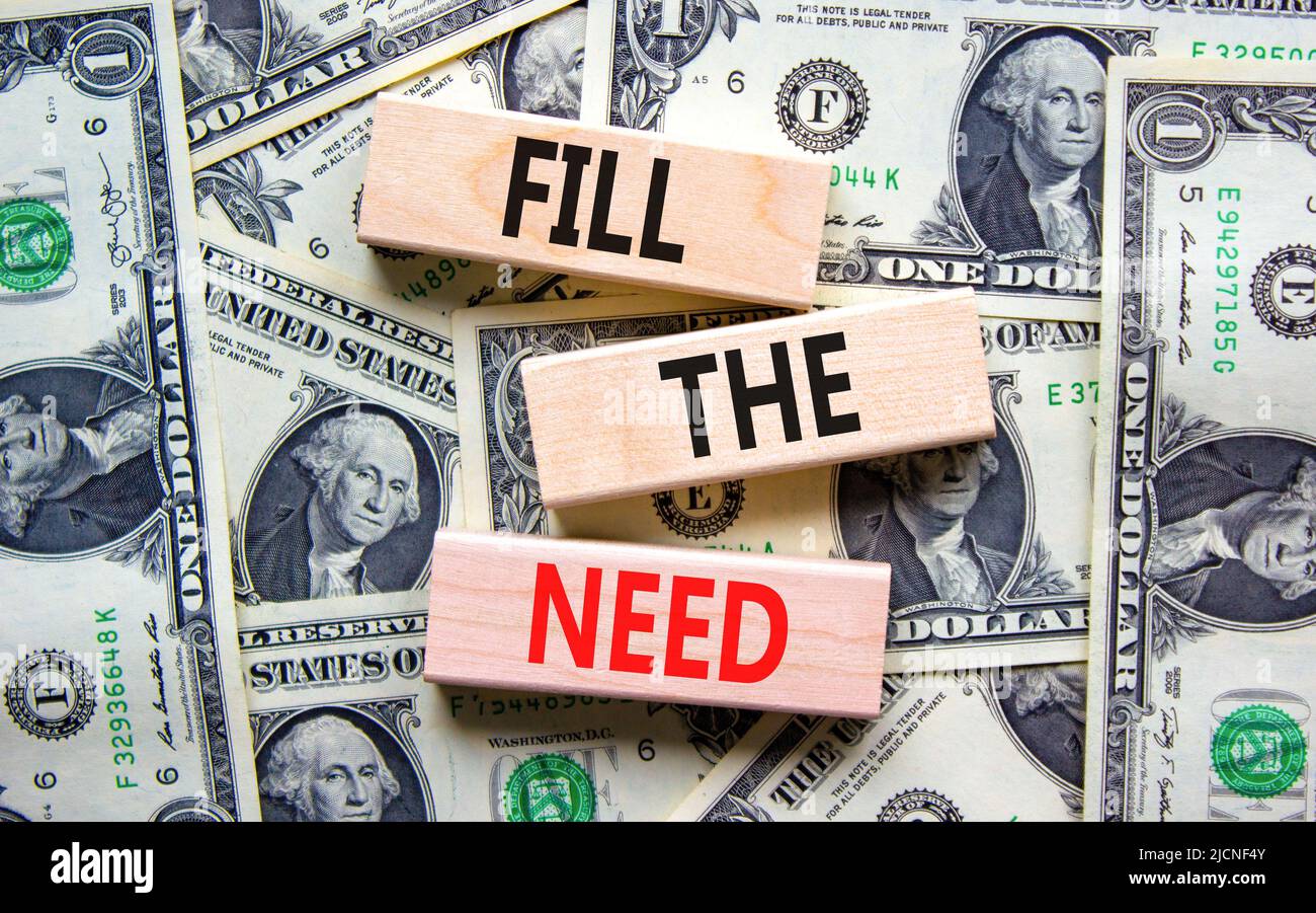 Fill the need symbol. Concept words Fill the need on wooden blocks on a ...