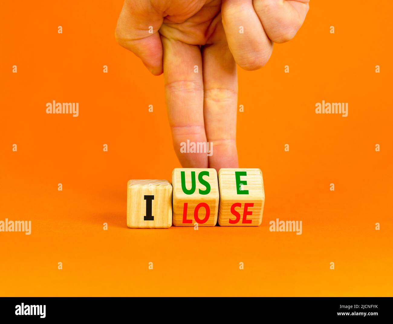 I use or lose it symbol. Concept words I use and I lose on wooden cubes ...