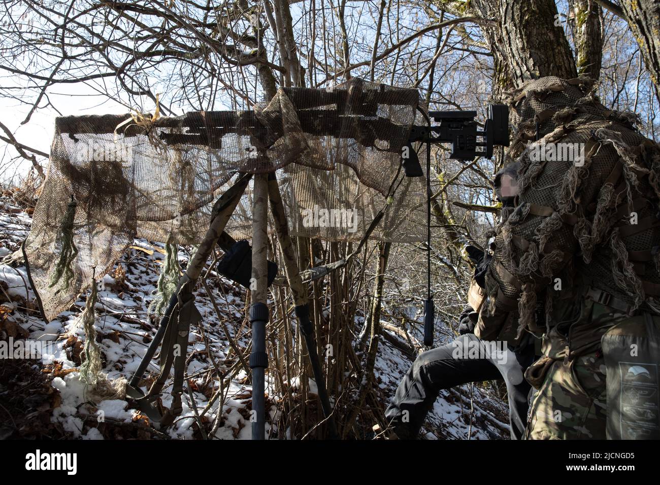 Snipers with 10th Special Forces Group observe a target during sniper ...