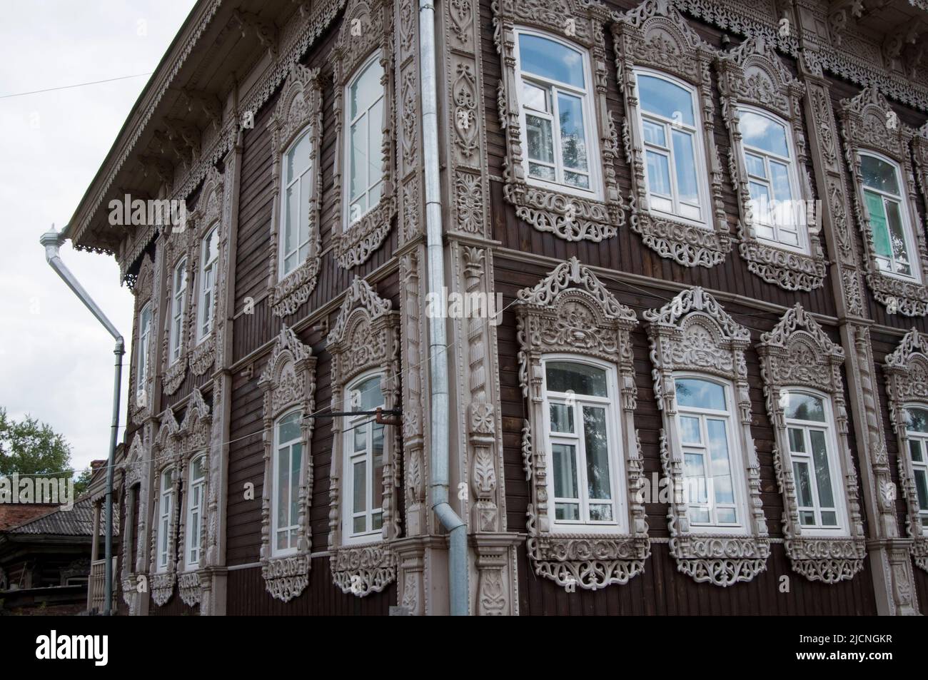 Beautiful wooden house in Tomsk. Ornate windows. Russian Federation ...