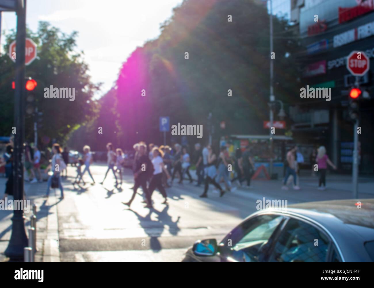 Blurred motion of crowd pedestrians crossing street in pedestrian ...
