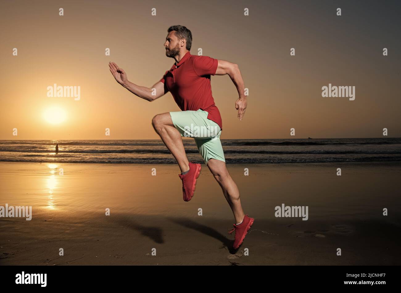 athletic man runner running on sunset summer beach, athlete Stock Photo ...