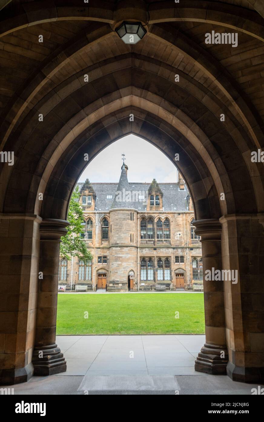 View through arch in Cloisters at Glasgow University campus in Scotland ...