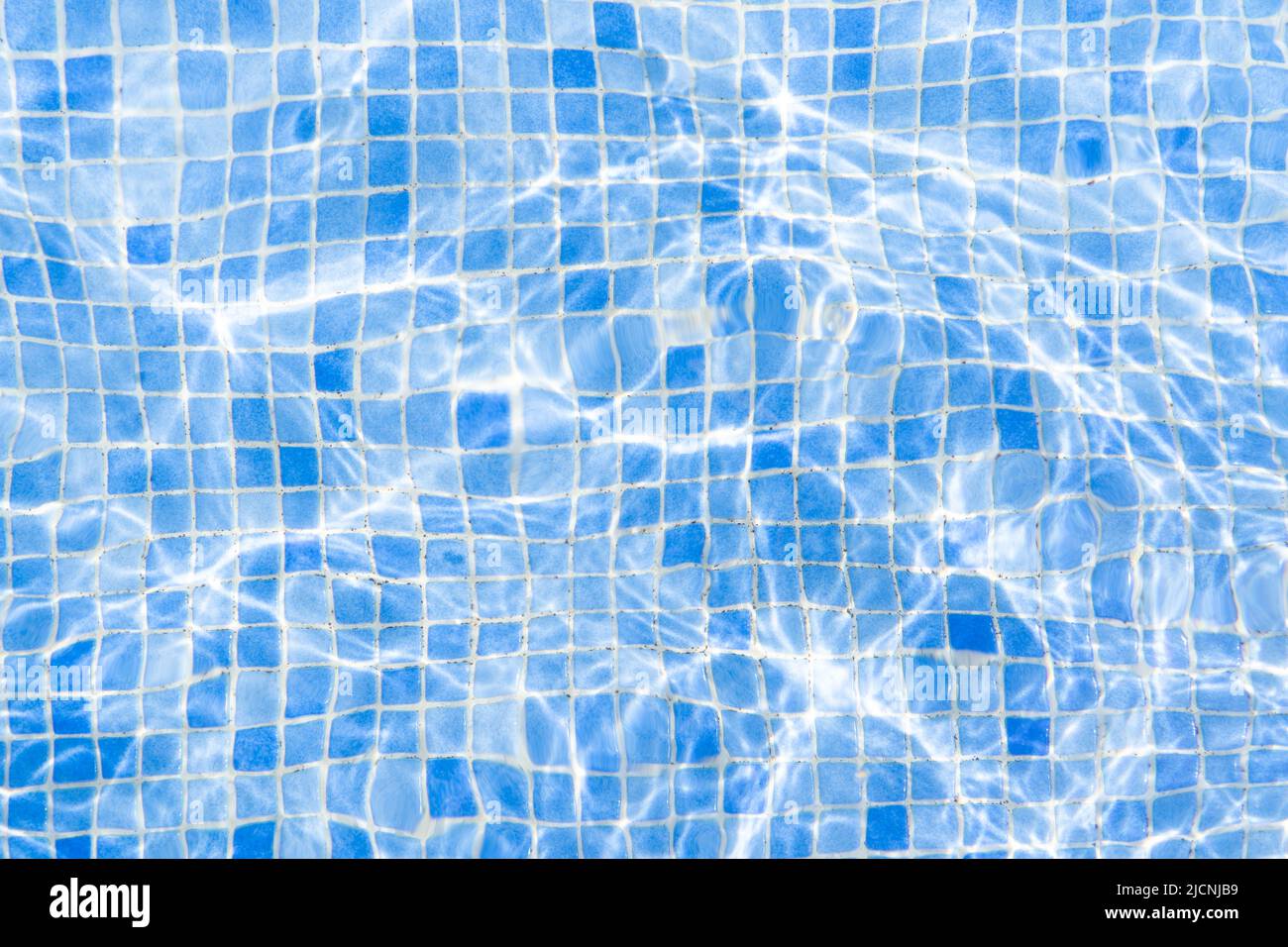 Background of the bottom of a swimming pool with little blue squares ...