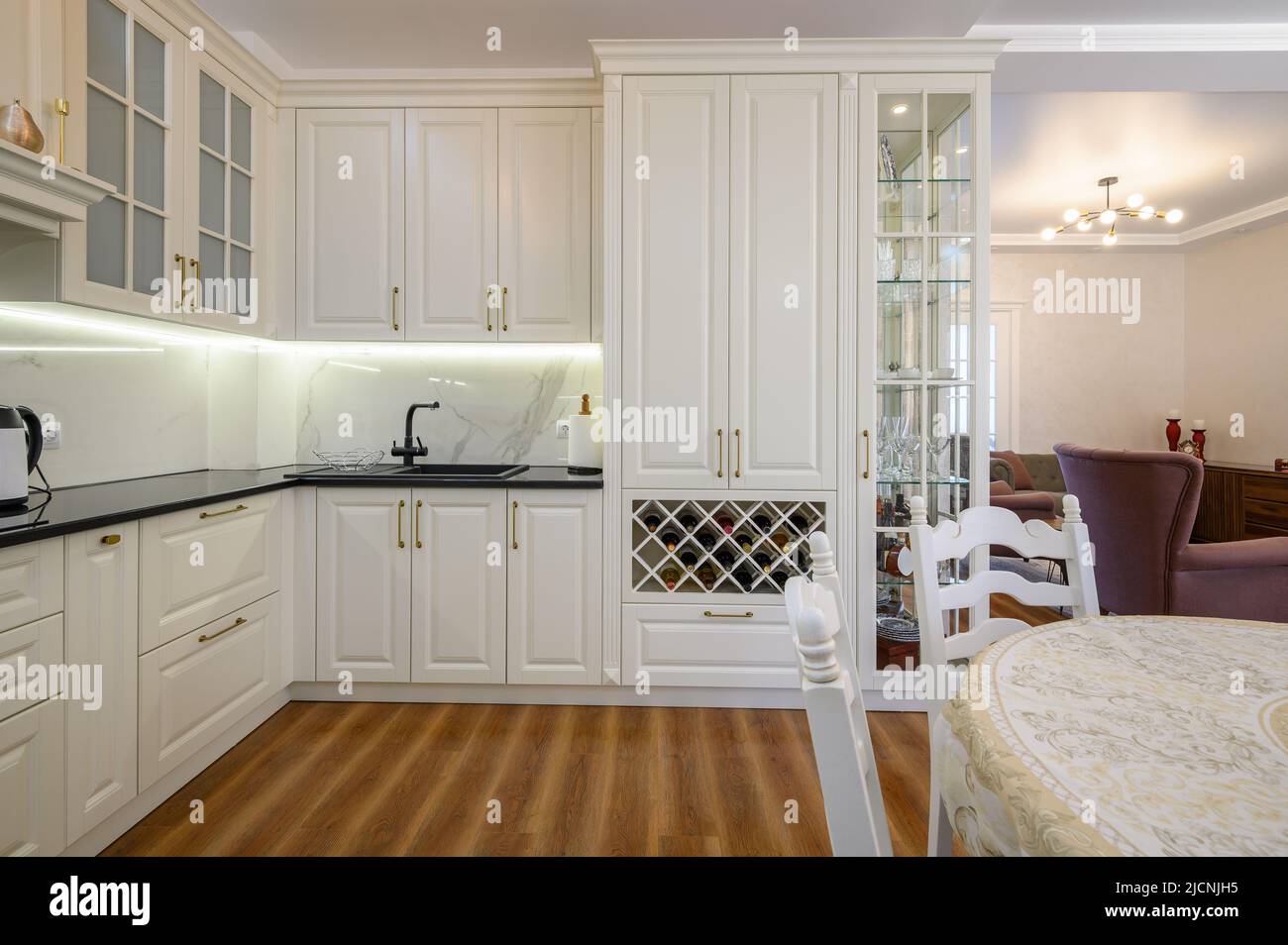 White luxiry modern classic kitchen furniture with dining table Stock ...
