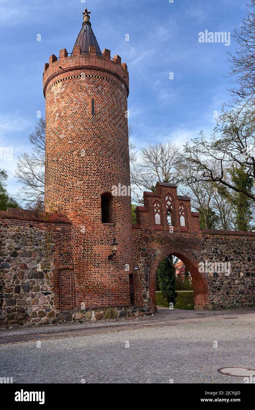 medieval fortifications with a round tower and a stone wall in ...