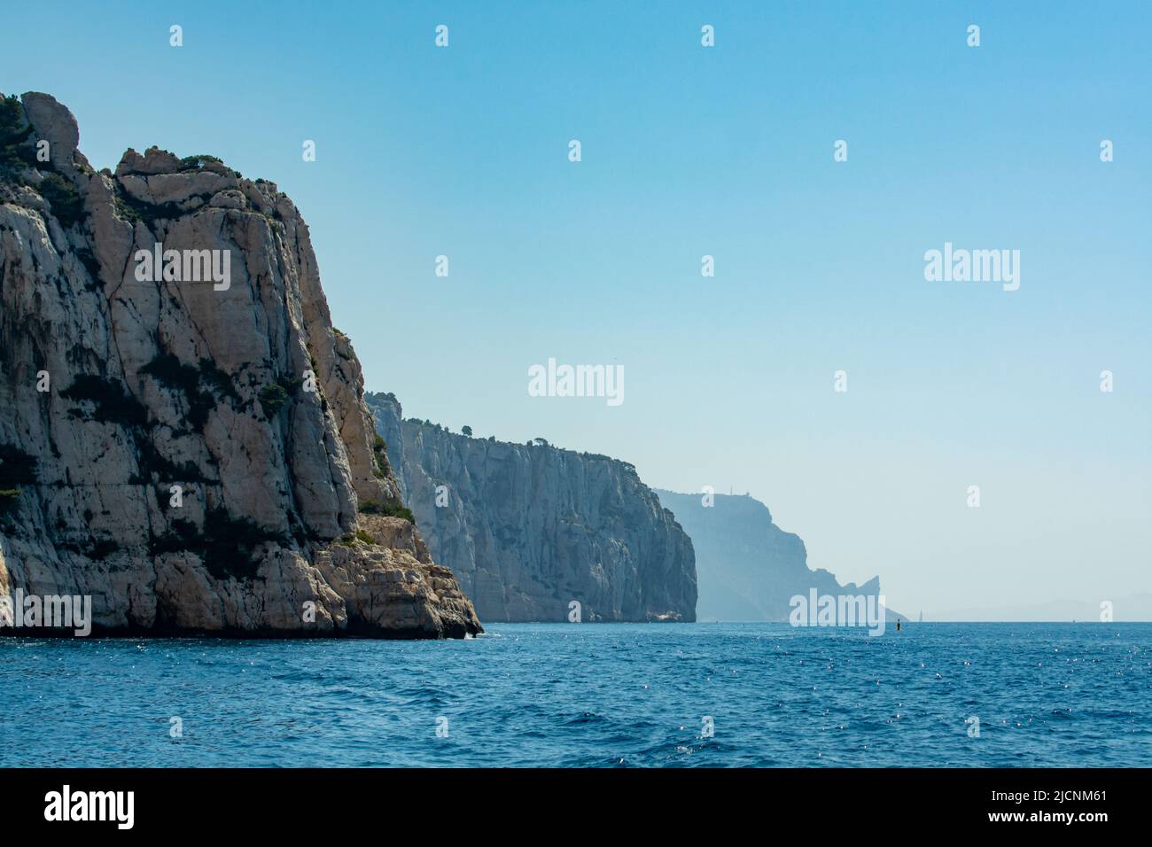 Limestone cliffs and blue sea near Cassis, boat excursion to Calanques ...