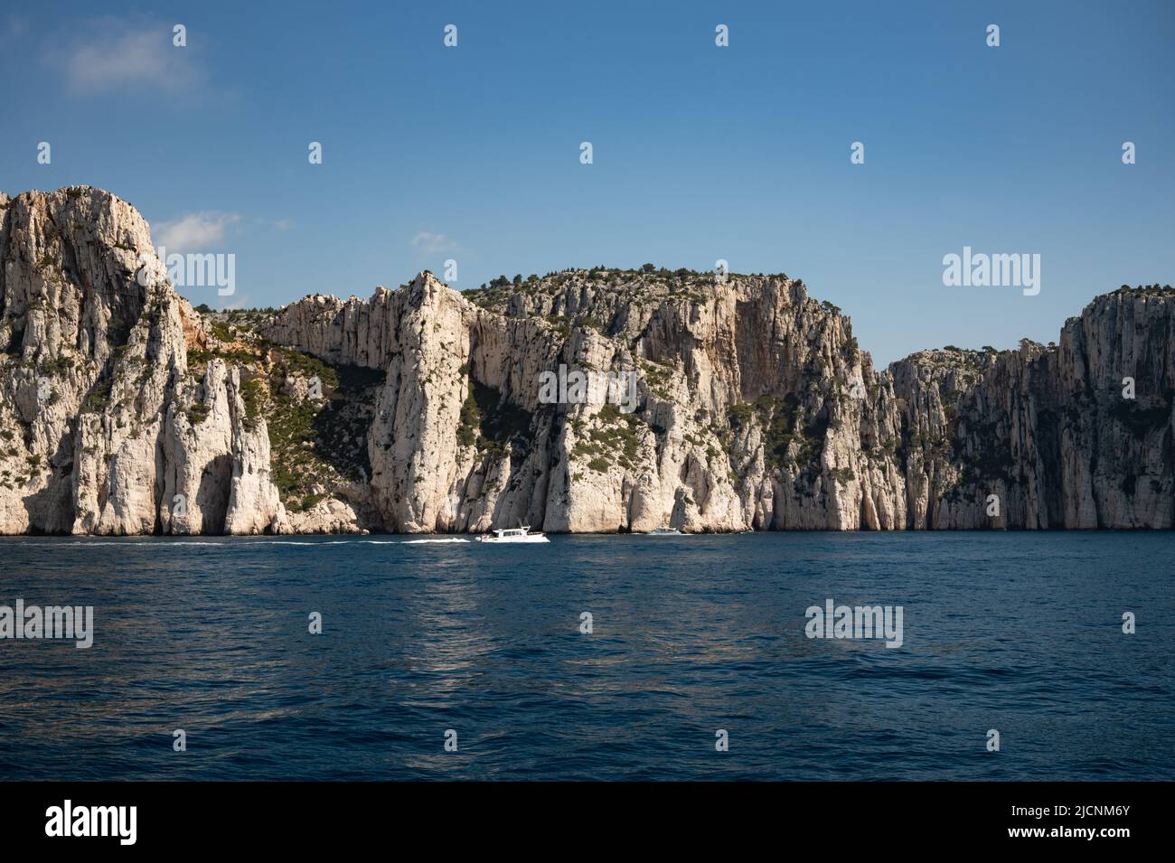 Limestone cliffs and blue sea near Cassis, boat excursion to Calanques ...