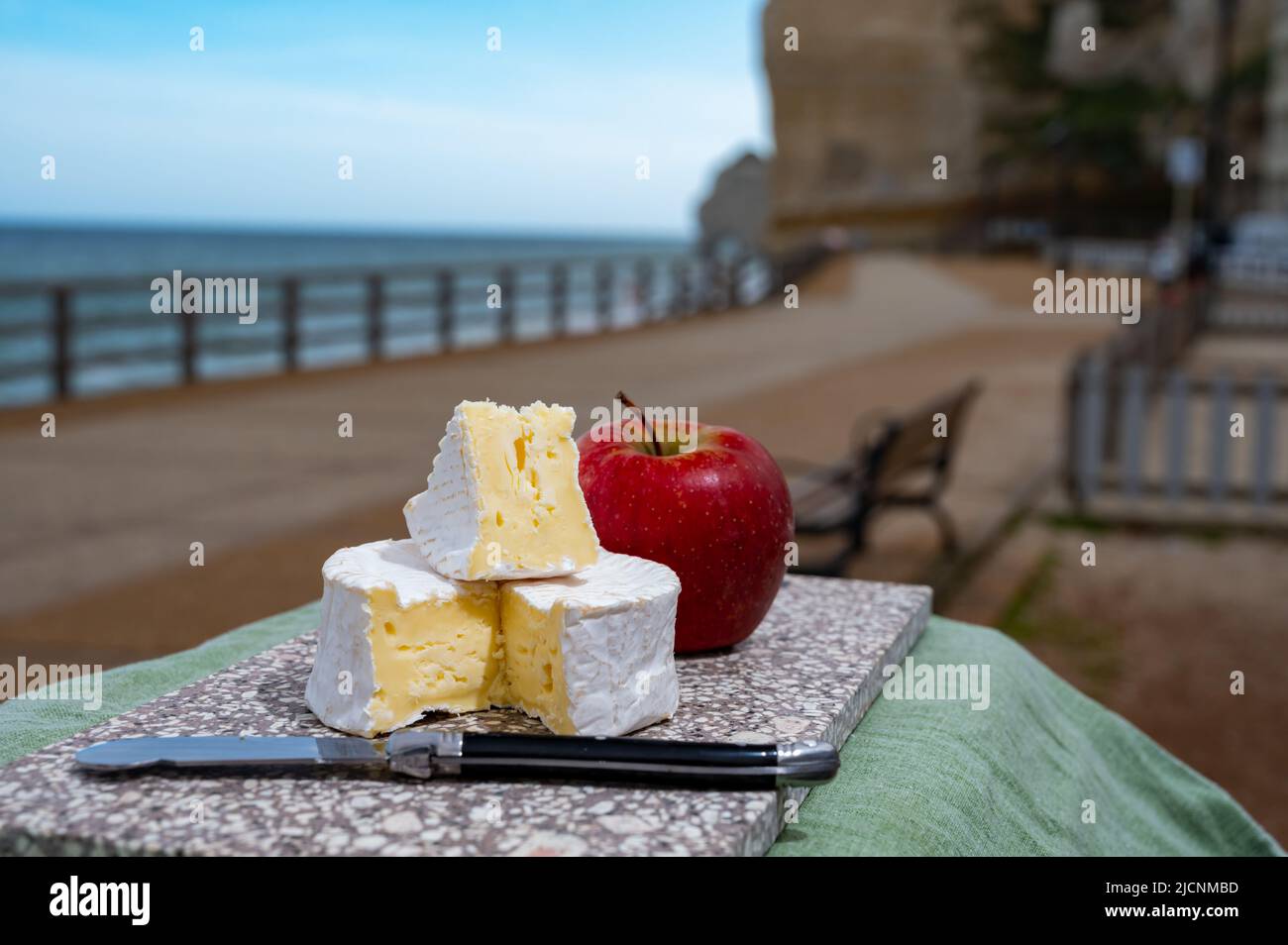 Tasting of round camembert cow cheese from Calvados region served ...