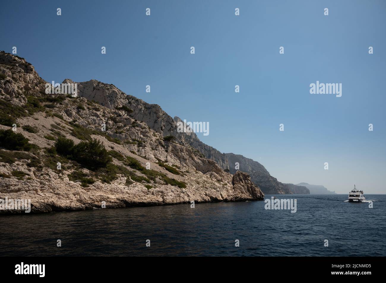 Limestone cliffs and blue sea near Cassis, boat excursion to Calanques ...