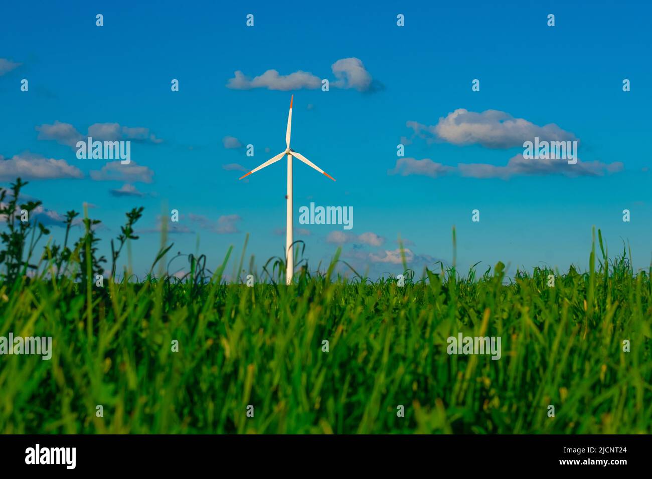 Windmill on blue sky background.renewable energy.Alternative energy ...