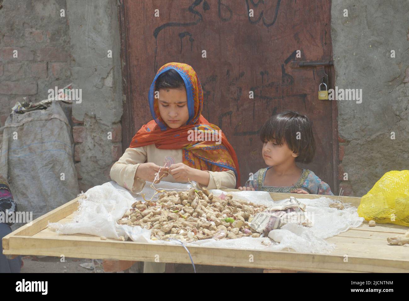 Child selling vegetables pakistan hi-res stock photography and images ...