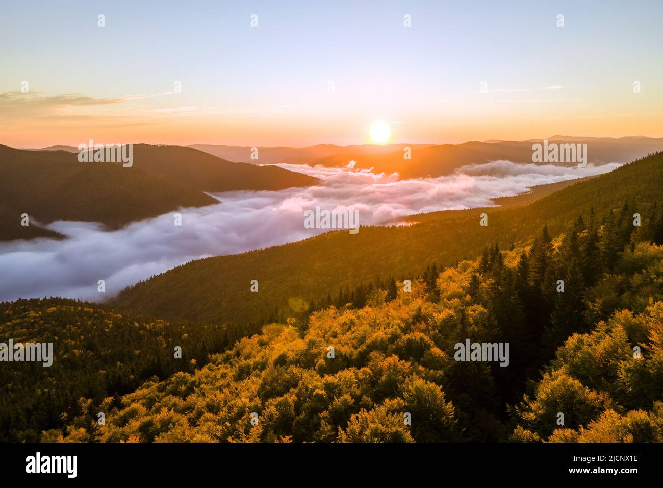 Sunshine rays over hills hi-res stock photography and images - Alamy