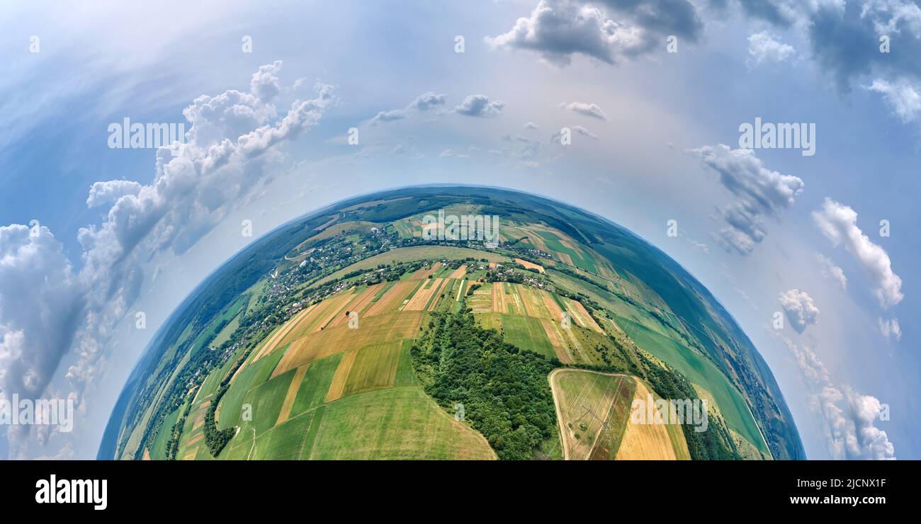 Aerial view from high altitude of little planet earth with green and ...